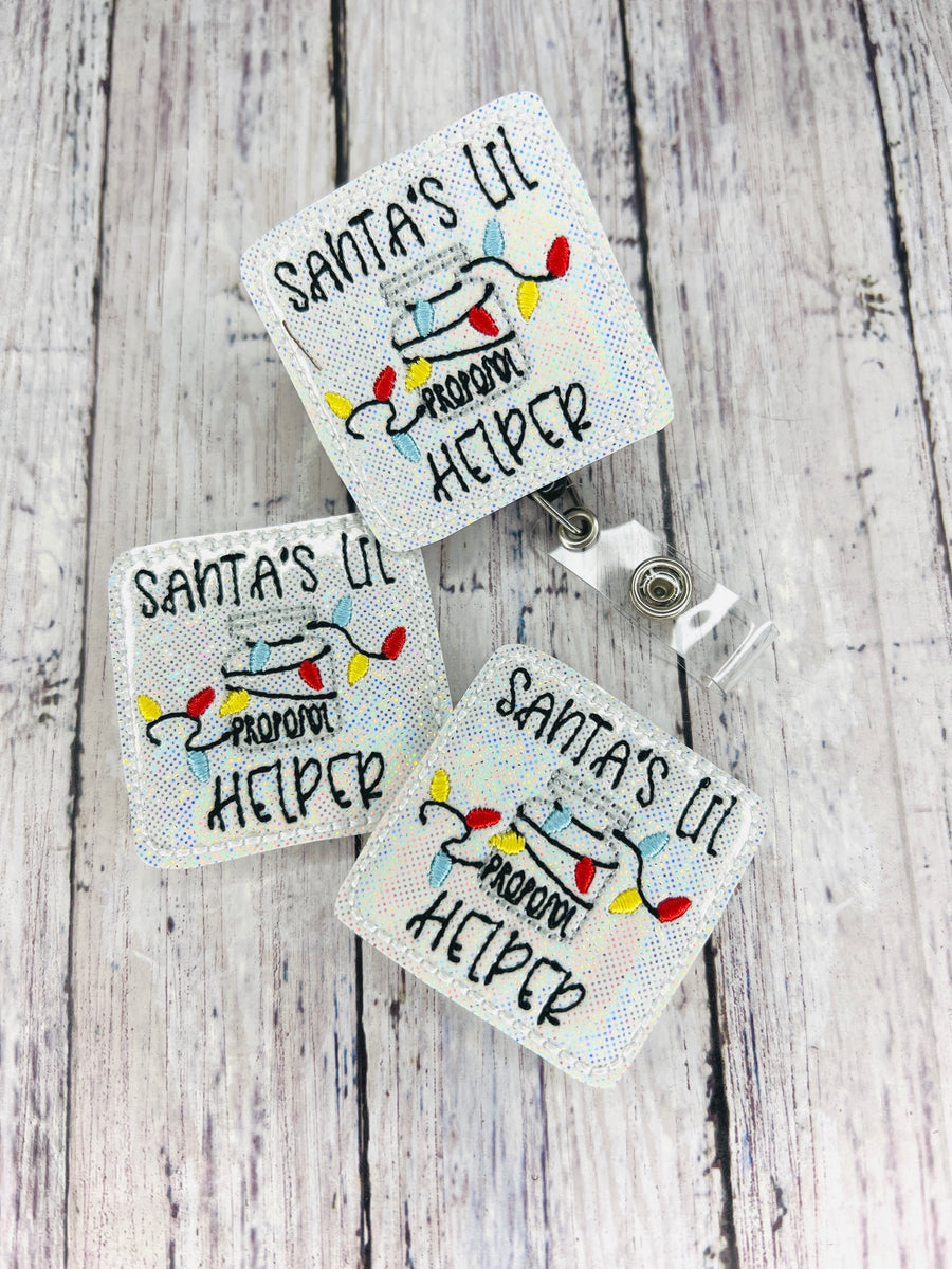 Propofol: Santa’s Little Helper Badge Feltie – All Stitched Up by Jill